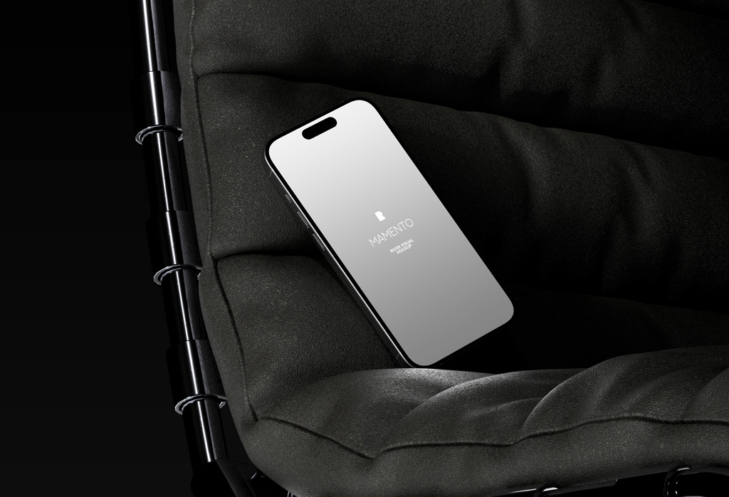 iPhone on dark Lounge Chair Mockup - Mockup World