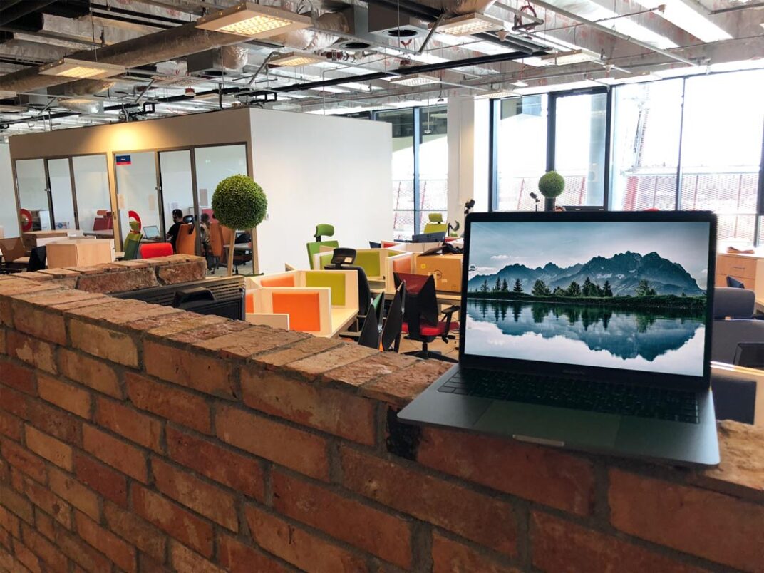 MacBook Pro in Office Space Mockup Set - Mockup World
