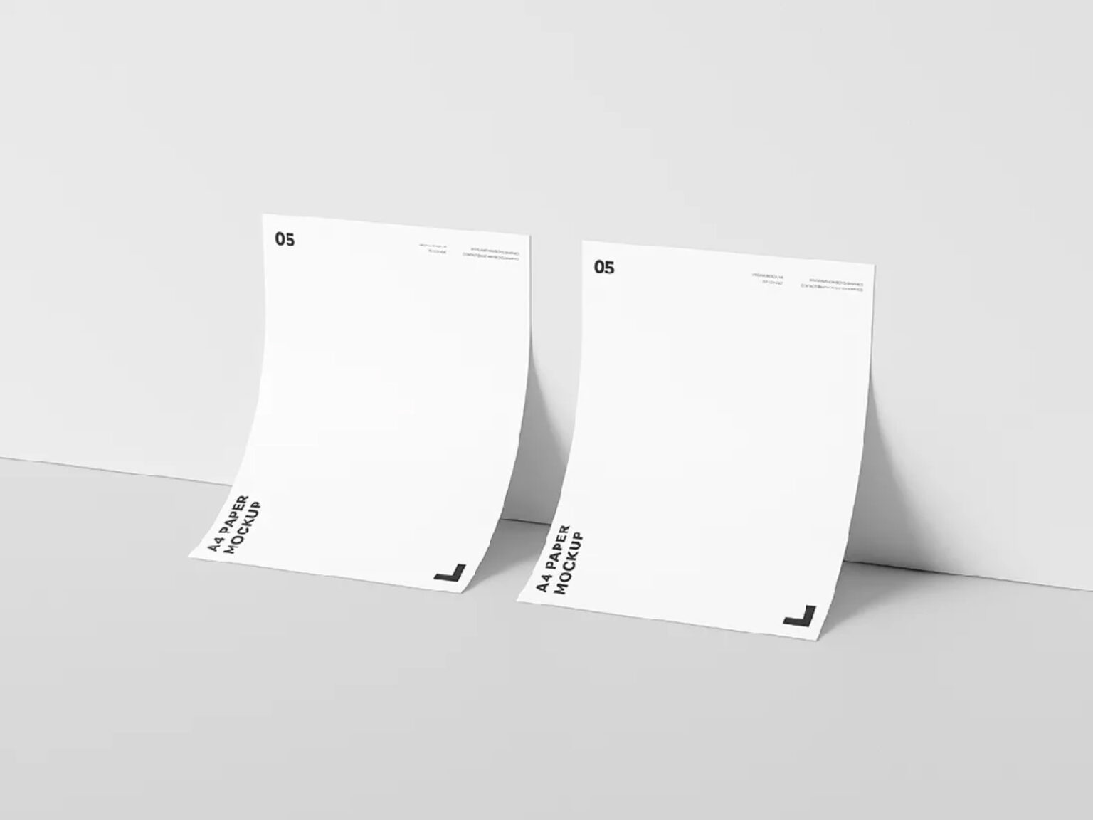 Sheets of A4 Paper leaning against Wall Mockup - Mockup World