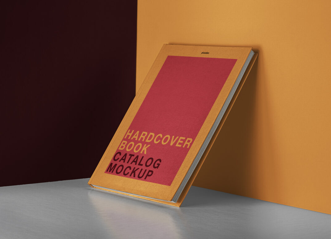 Hardcover Book leaning against Wall Mockup - Mockup World